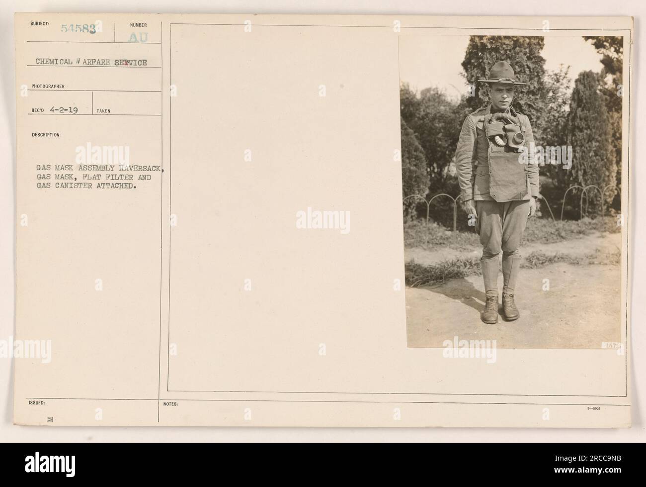 A soldier assembles a gas mask. The gas mask assembly consists of a ...