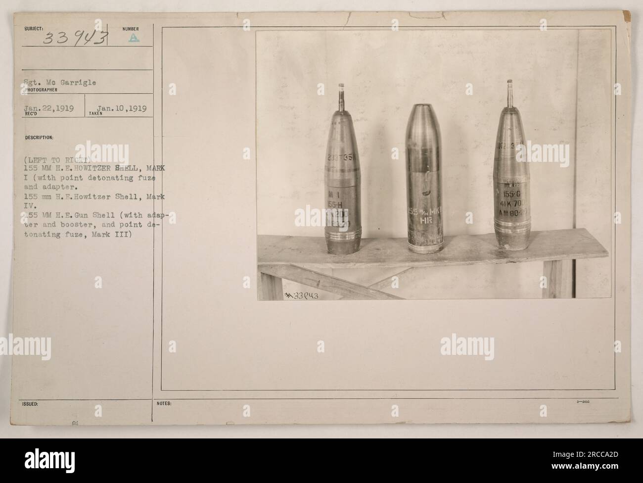 Sergeant Mo Garrigle is pictured with various types of 155 mm howitzer ...