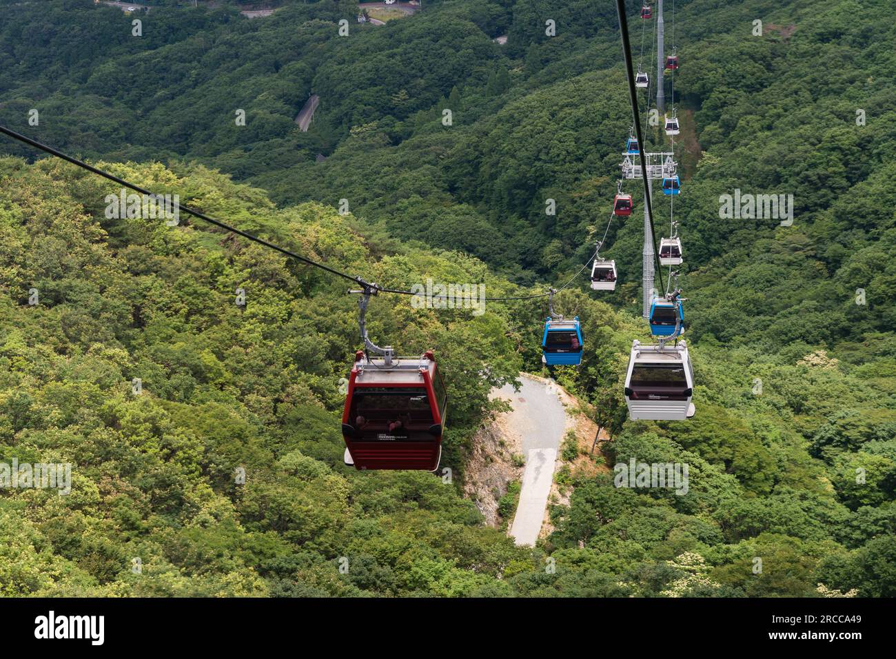 View of cable cars on Geojedo with the background of Mountain Stock ...