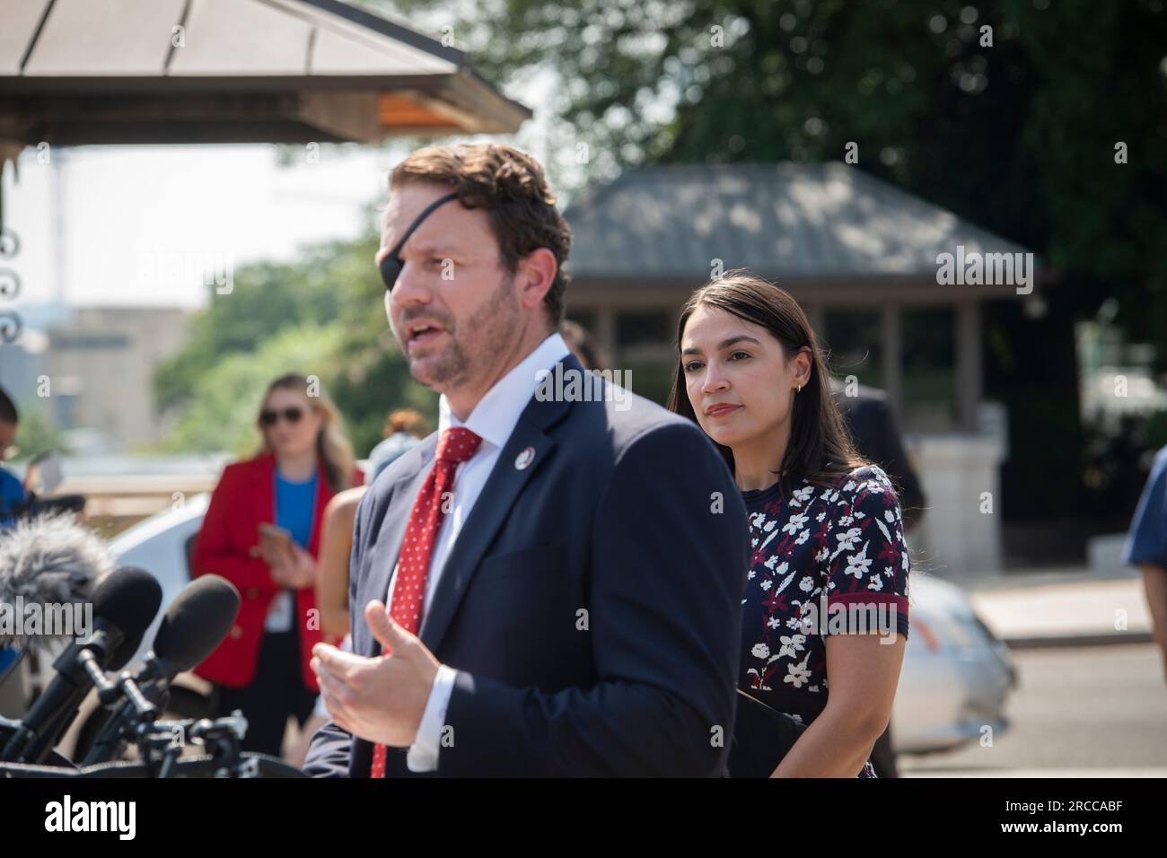 United States Representative Dan Crenshaw (Republican of Texas), left ...