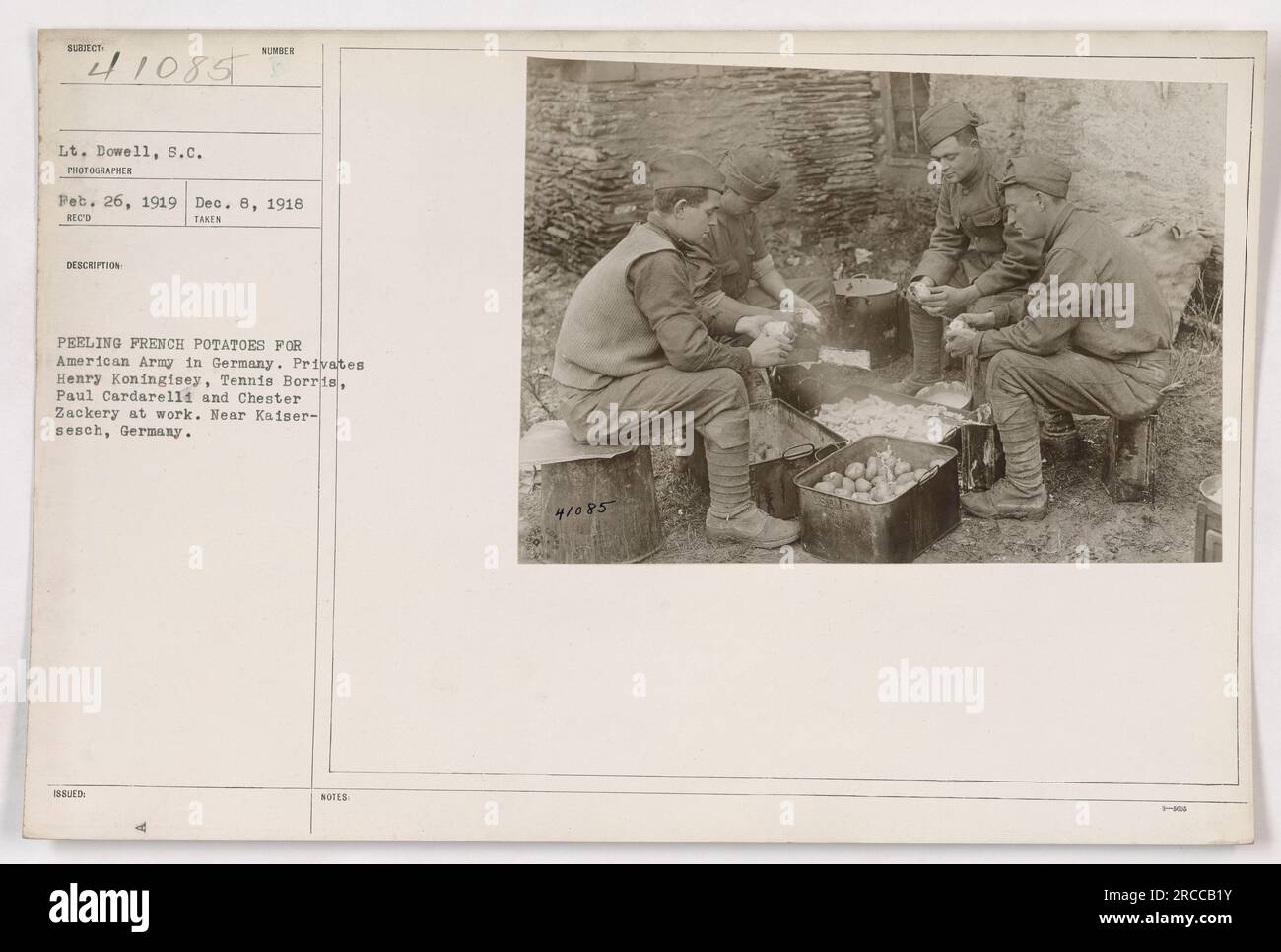 American soldiers peeling potatoes at a location near Kaiser- sesch ...