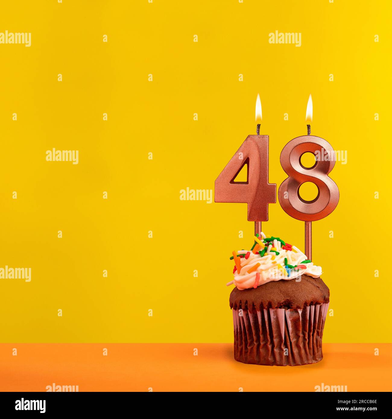 Number 48 birthday candle - Celebration on yellow background Stock ...