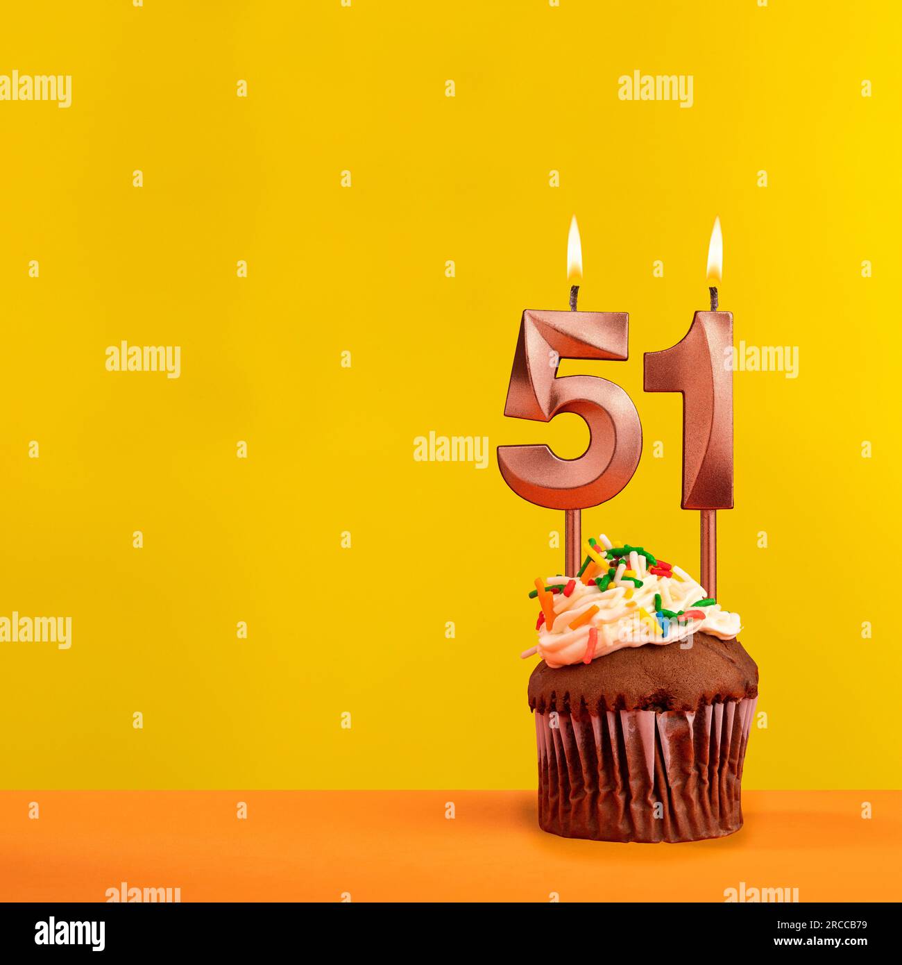Candle with flame number 51 - Birthday card on yellow background Stock ...