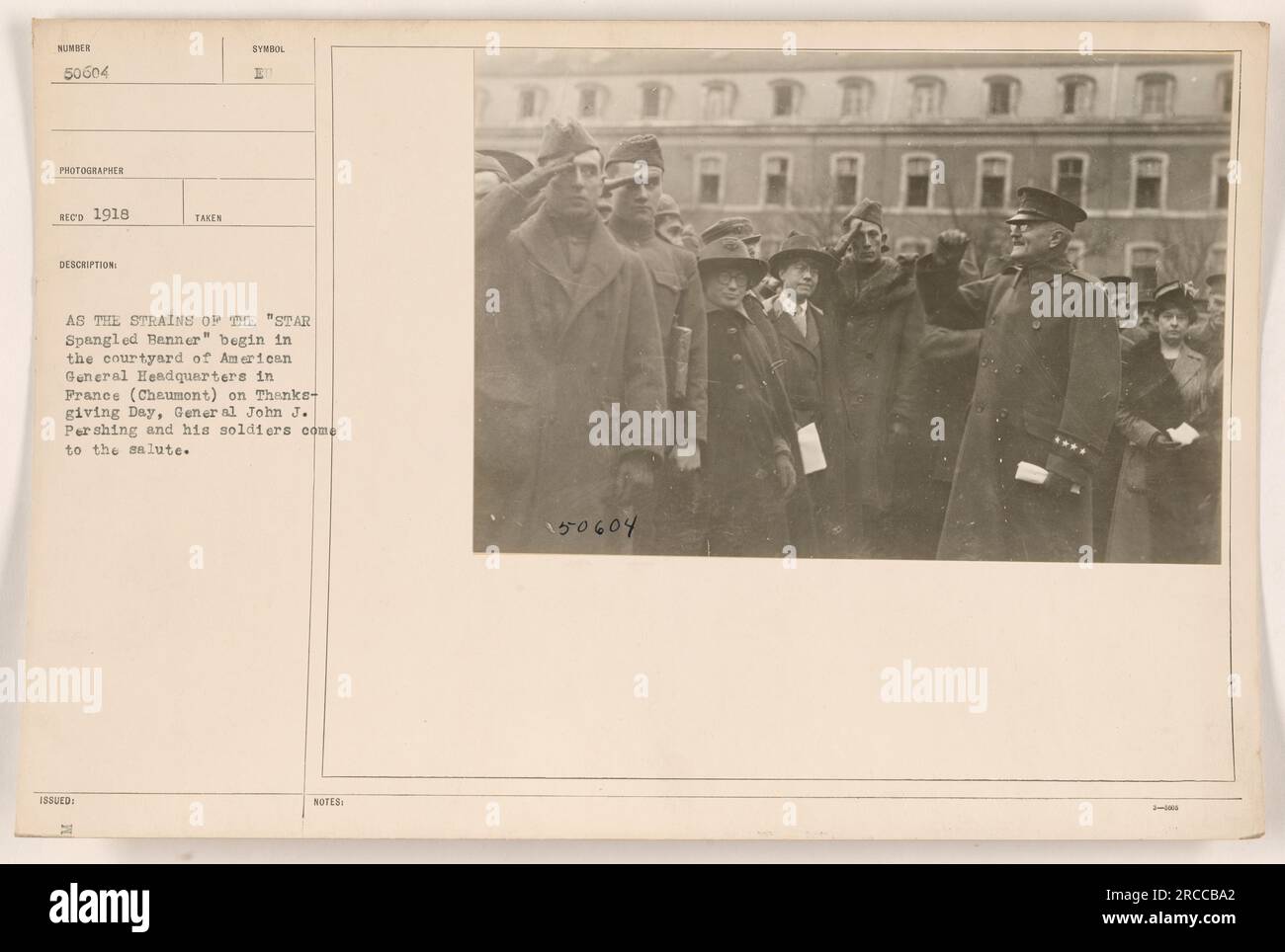 Caption: General John J. Pershing and American soldiers salute while ...