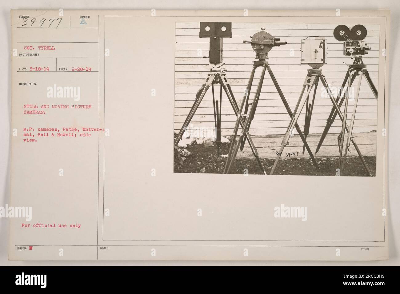 The image shows a collection of still and moving picture cameras used ...