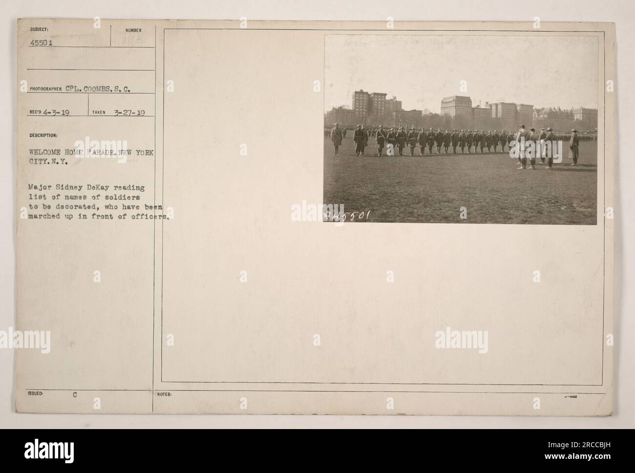 Major Sidney DeKay reading a list of names of soldiers to be decorated ...