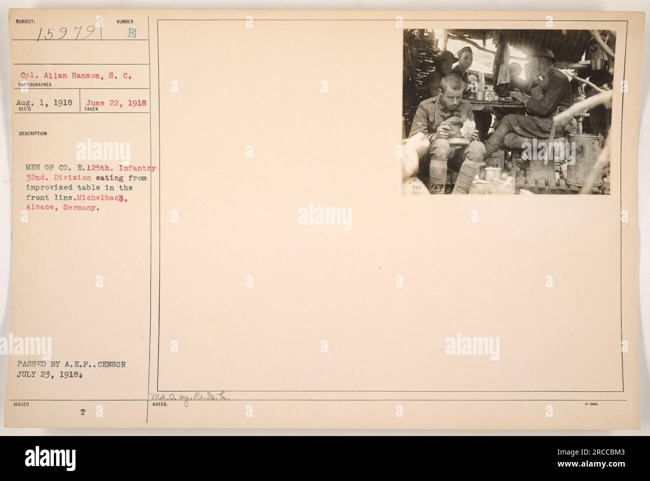 Men of Co. E, 125th Infantry, 32nd Division can be seen eating from an ...