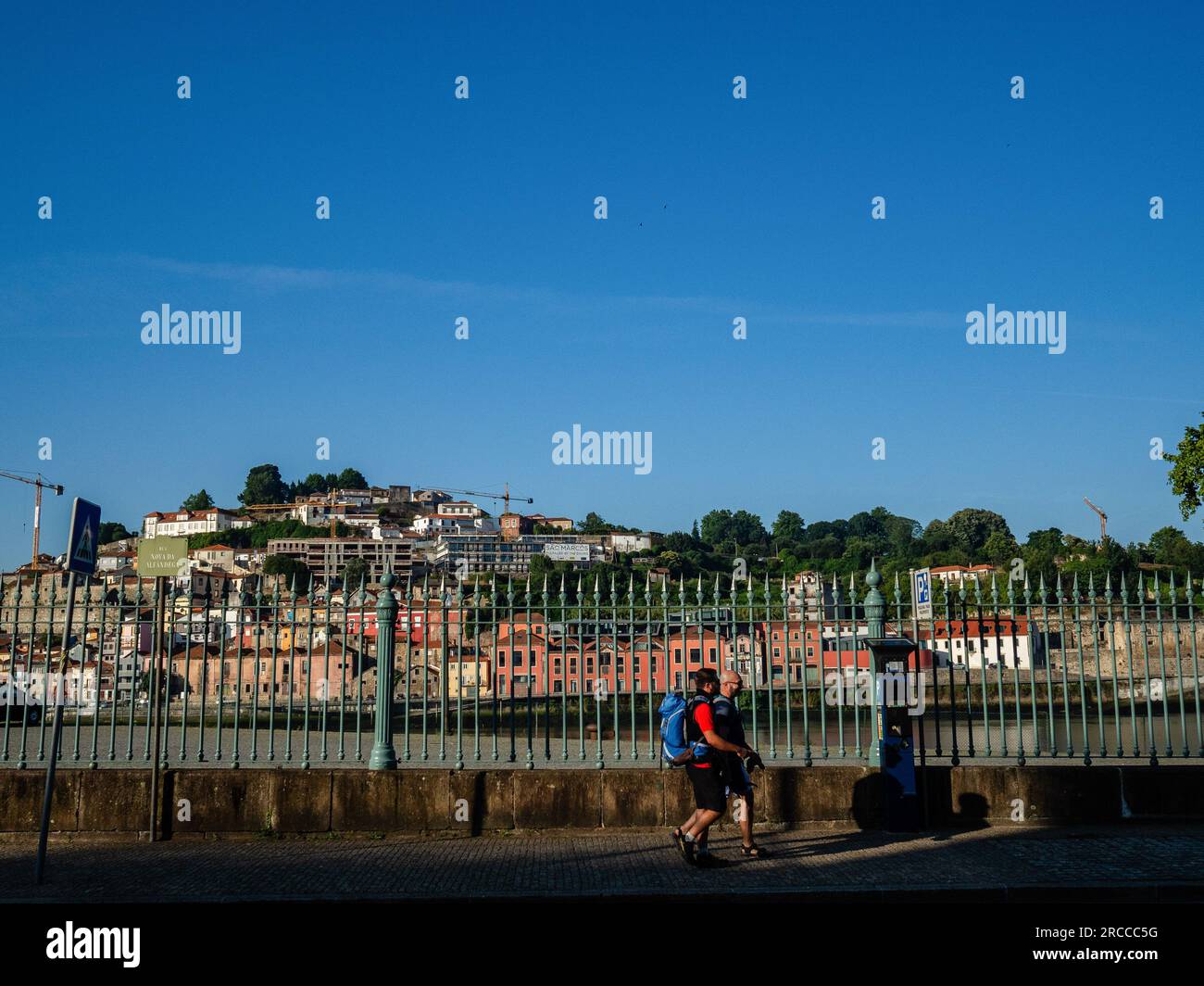 Two pilgrims are seen leaving the city early in the morning. The ...