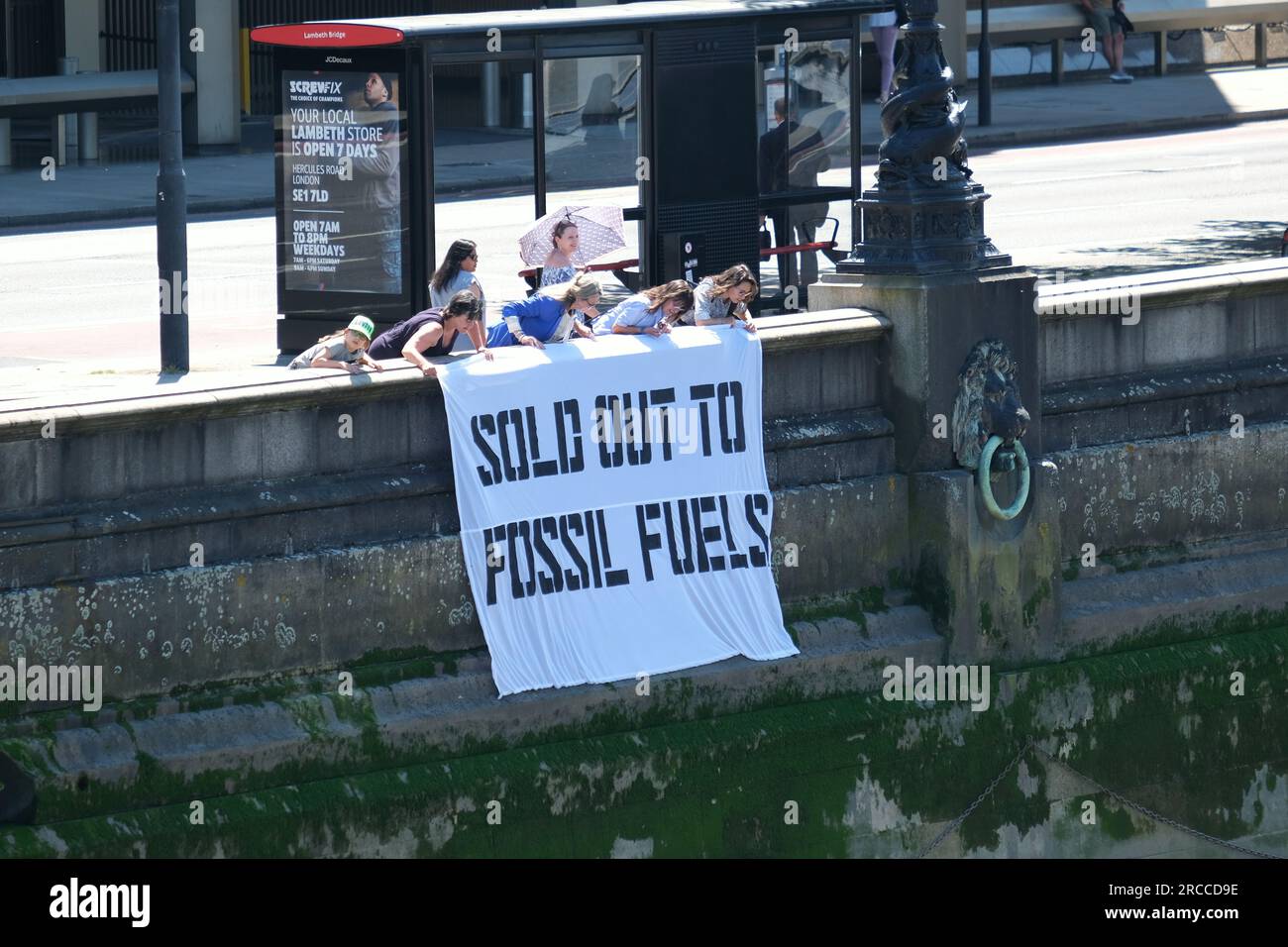 Ocean Rebellion activists hold a banner outside the International ...