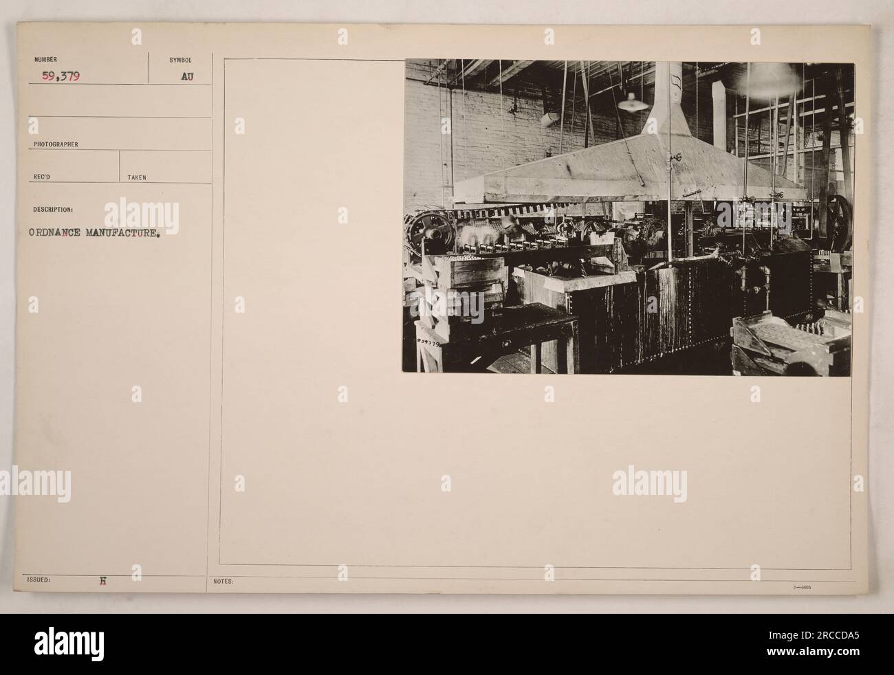 This photograph depicts an ordnance manufacturing process during World ...
