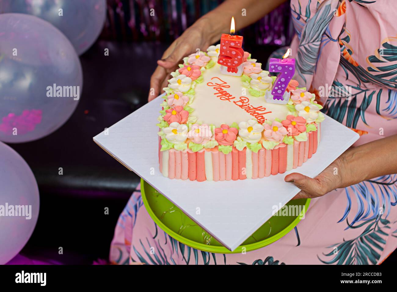 girl's hand holding a birthday cake Focus on the happy moments Stock ...
