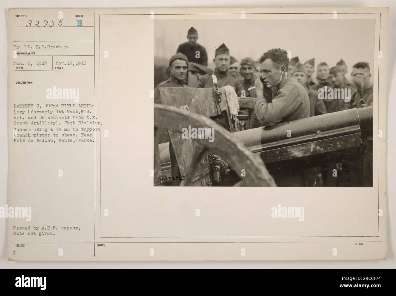 Gunner from Battery C, 102nd PTFLD Artillery, 26th Division, using a ...