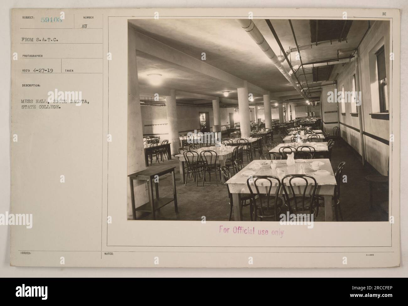 Soldiers gathered at the mess hall at South Dakota State College during ...