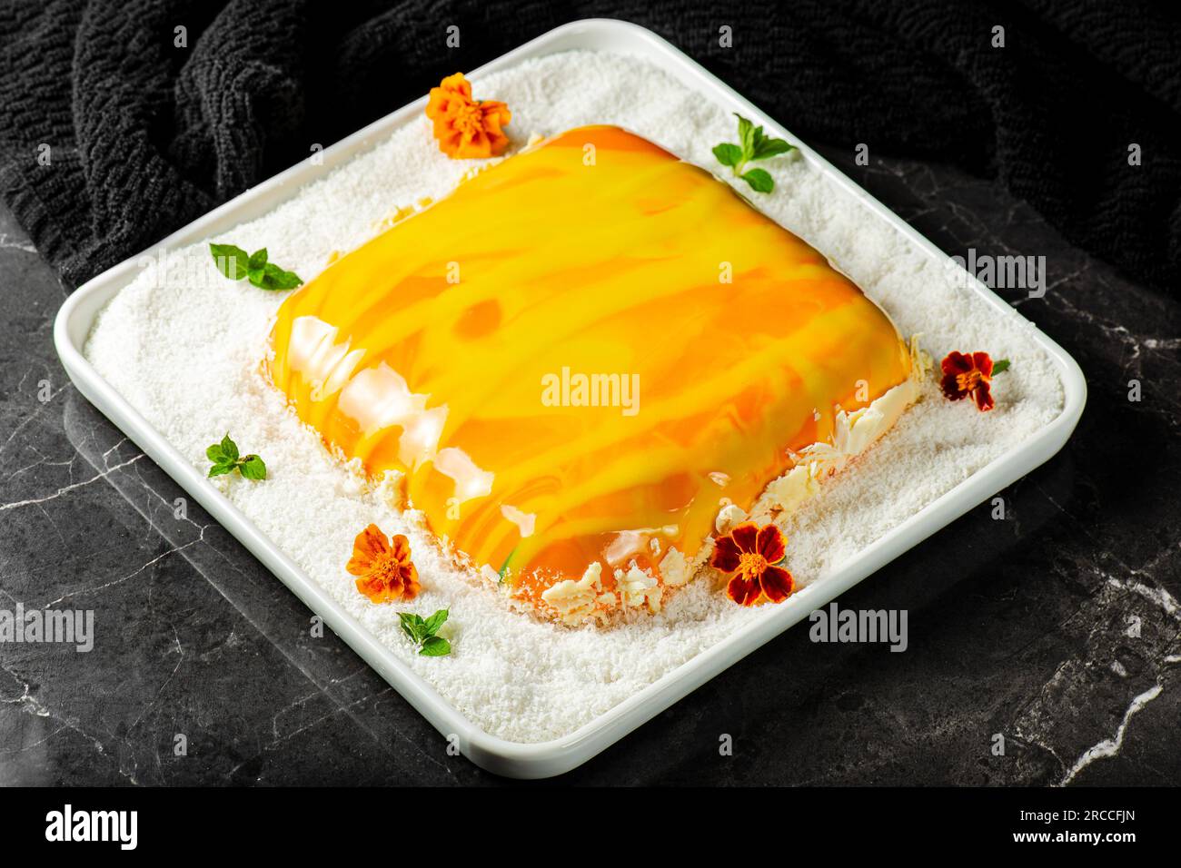 Gourmet Entremet Cake with layered sponge cake, mango jelly, coconut ...