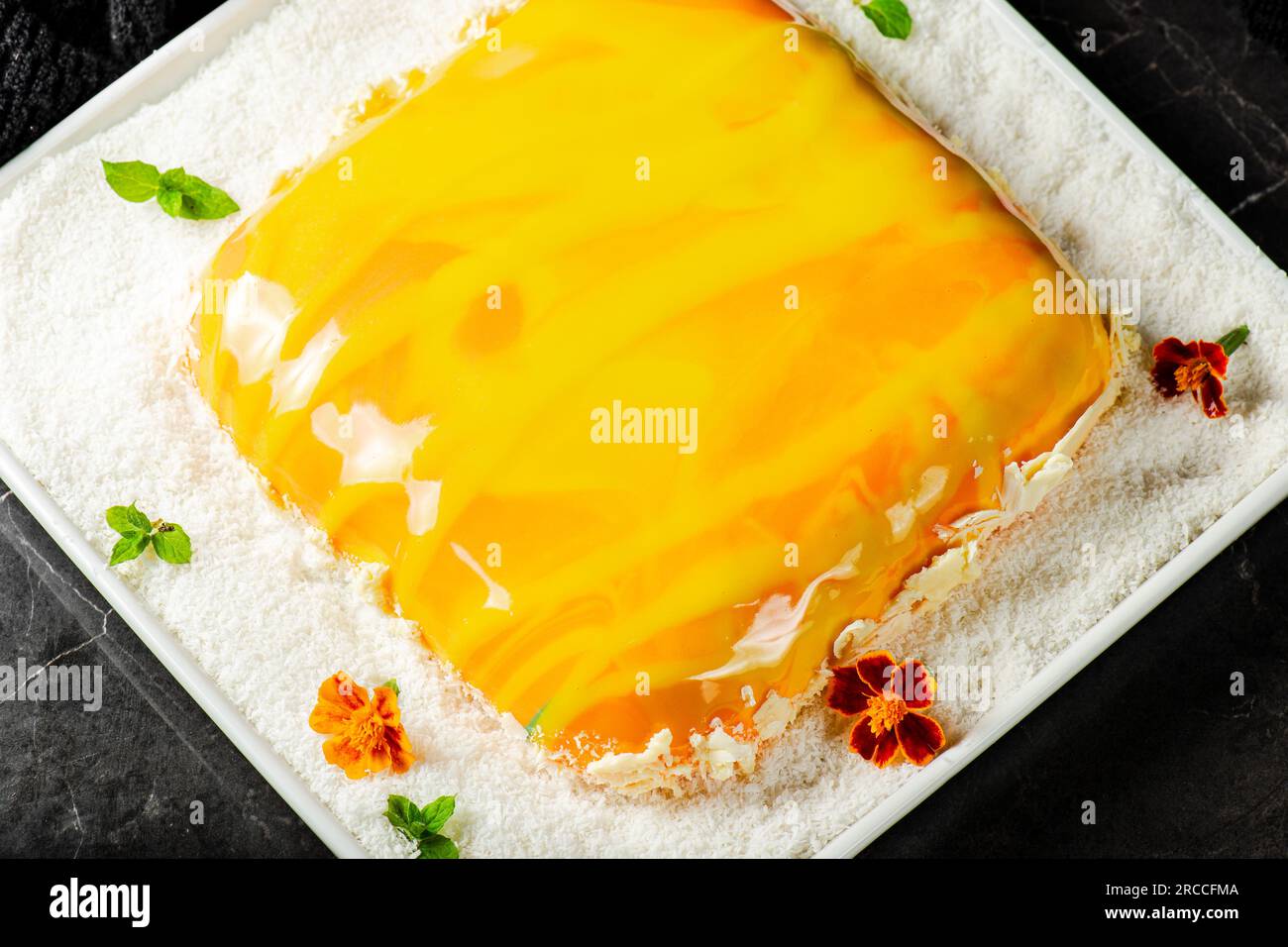 Gourmet Entremet Cake with layered sponge cake, mango jelly, coconut ...
