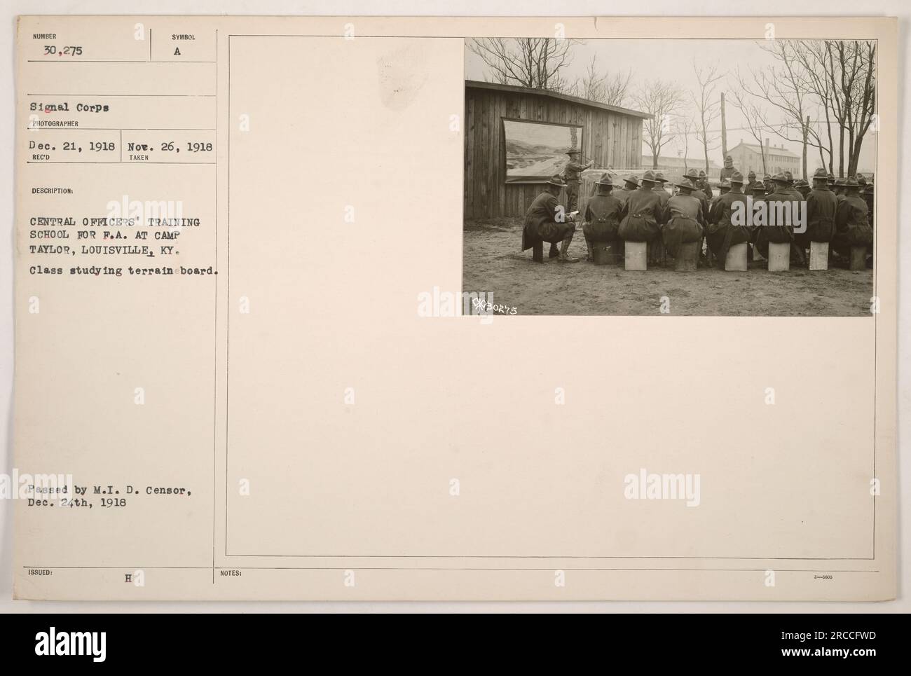 Officers studying a terrain board at the Central Officers' Training School for Field Artillery ...