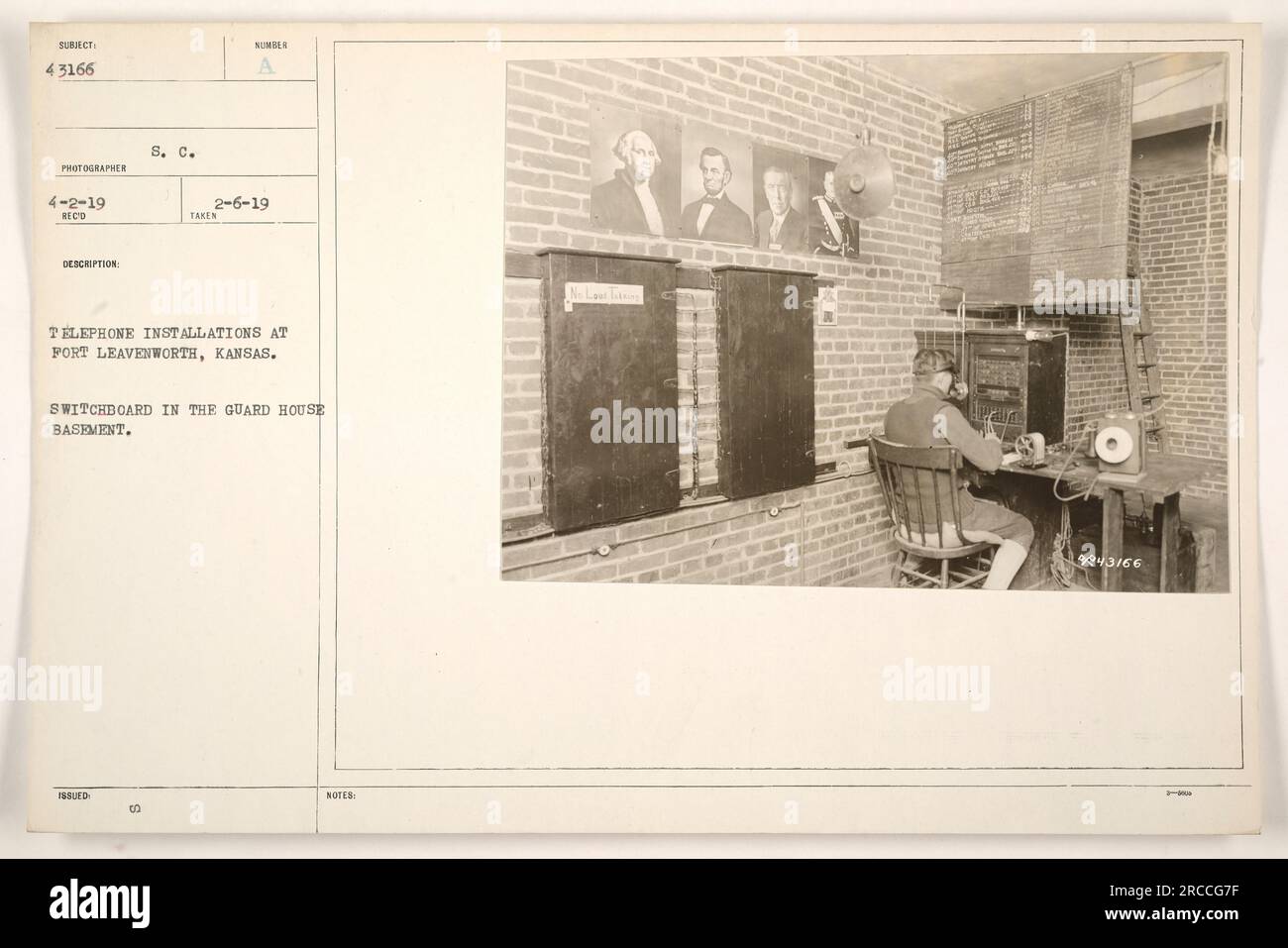 Photograph depicts a telephone switchboard in the basement of the guard ...