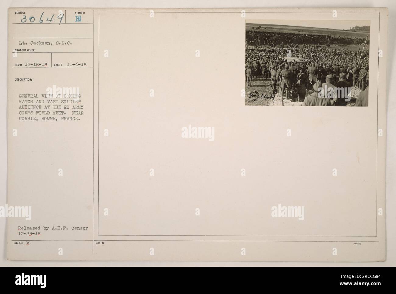 Caption: "Lt. Jackson captures a general view of a boxing match at the ...