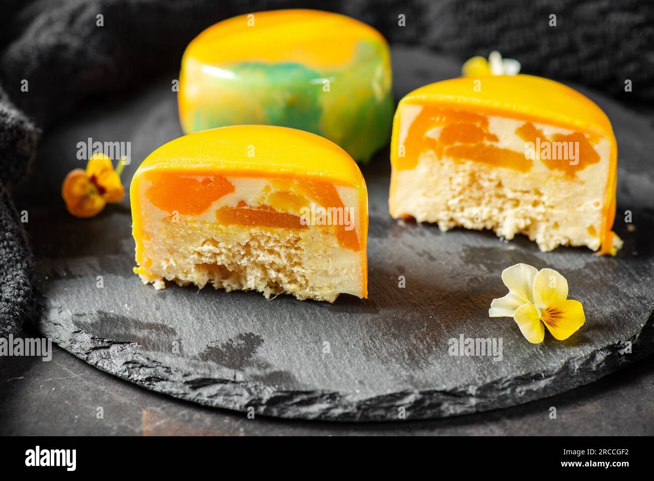 Gourmet Entremet with layered sponge cake, mango jelly and mousse ...