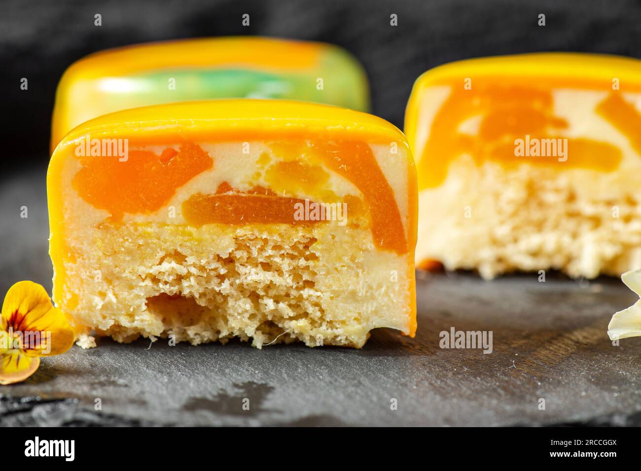 Gourmet Entremet with layered sponge cake, mango jelly and mousse ...