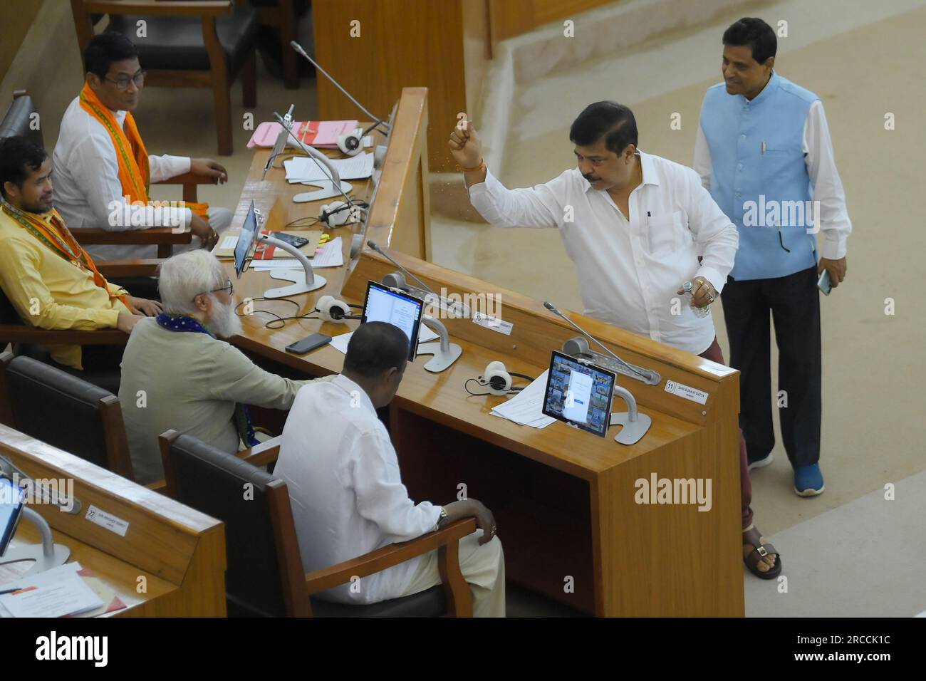 Congress MLA Sudip Roy Barman, spreading holy water in the assembly before the start of the ...