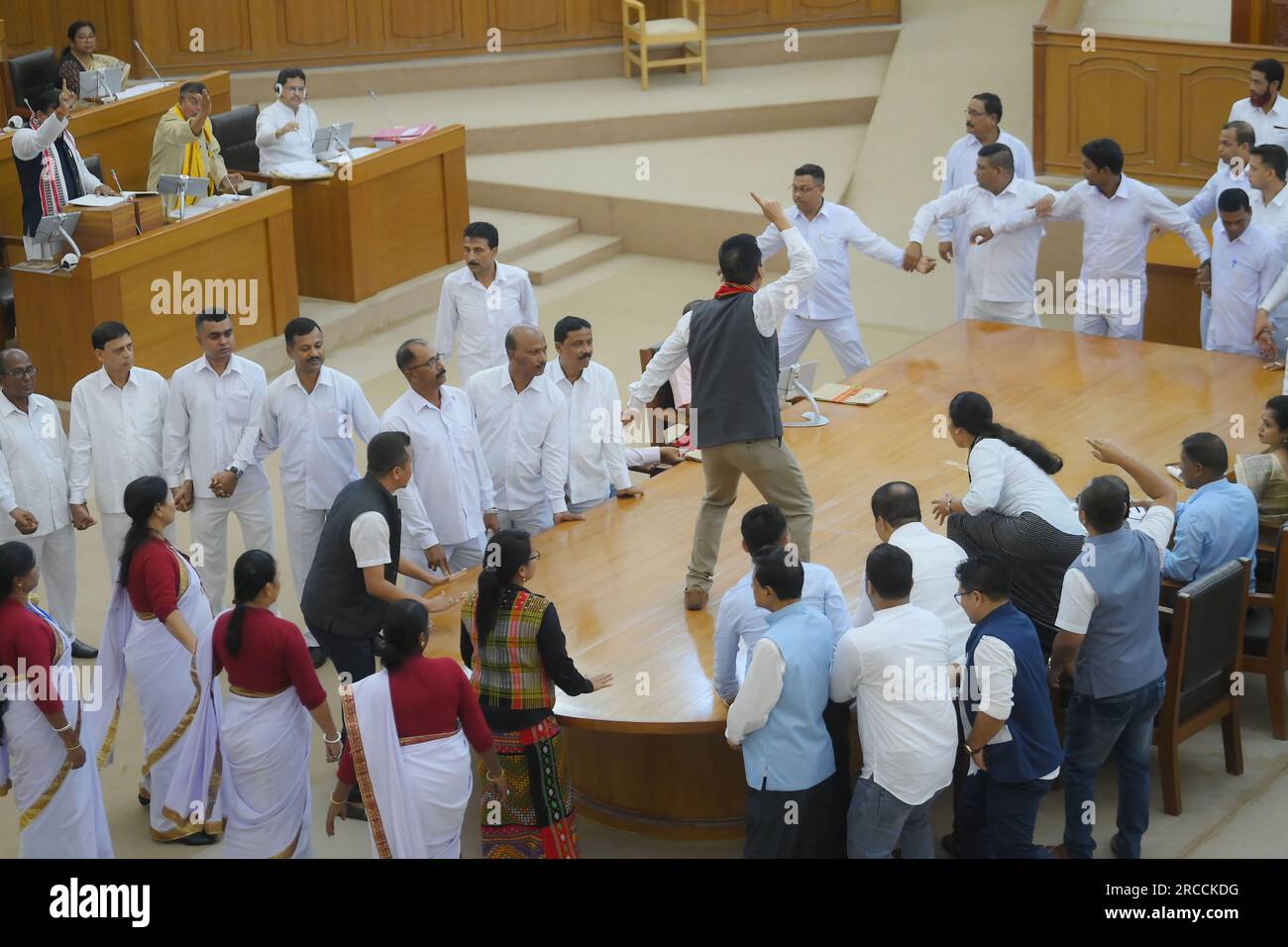 Congress MLA Sudip Roy Barman, spreading holy water in the assembly before the start of the ...