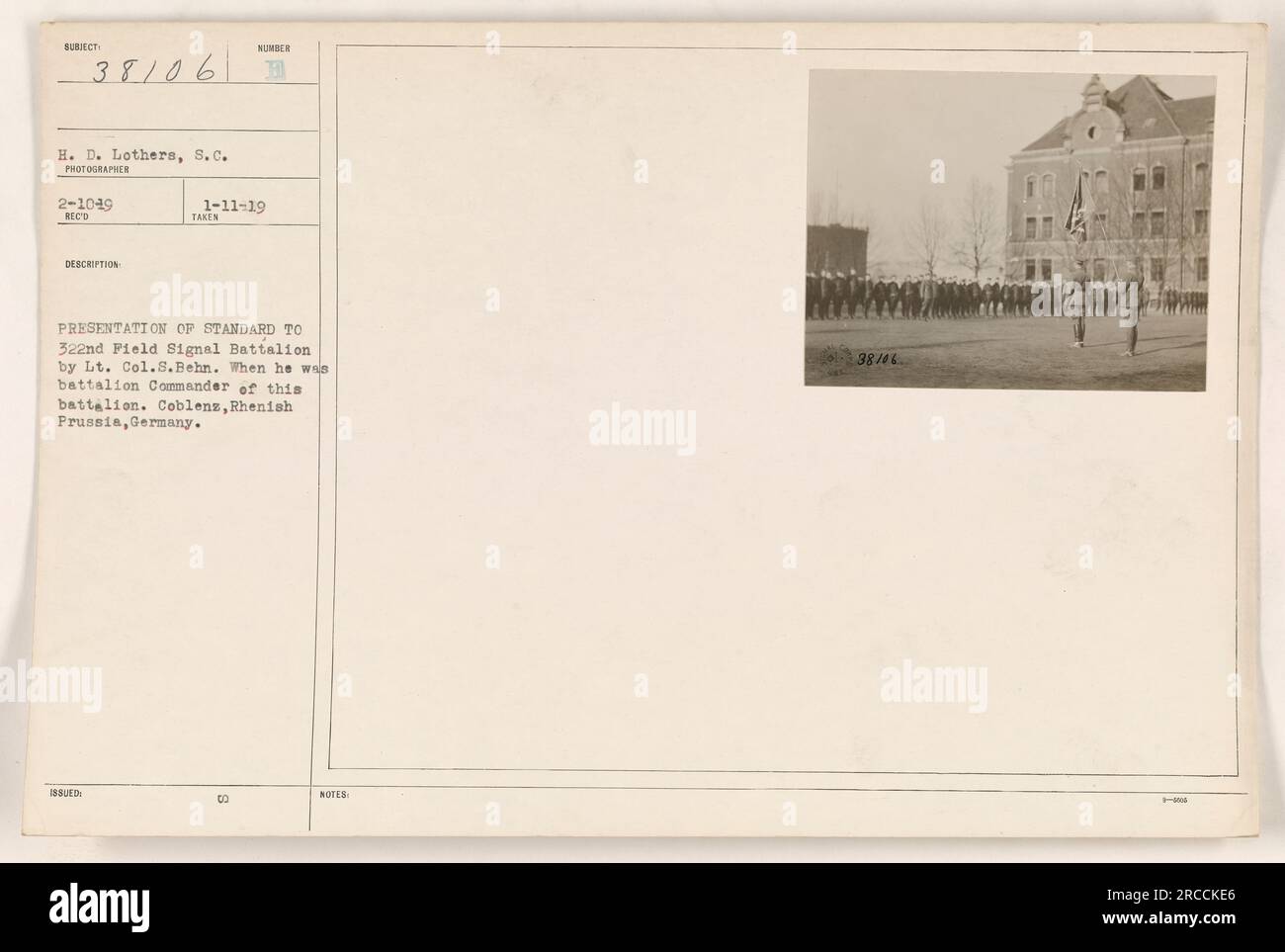 Lt. Col. S.Behn presents a standard to the 322nd Field Signal Battalion ...