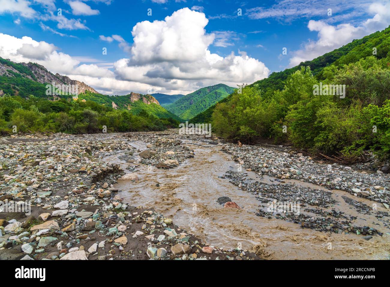 Bed of a mountain river with boulders and pebble Stock Photo - Alamy
