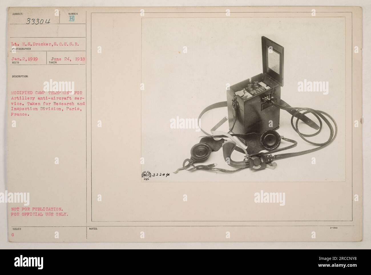 This photograph depicts a modified camp telephone for artillery anti ...