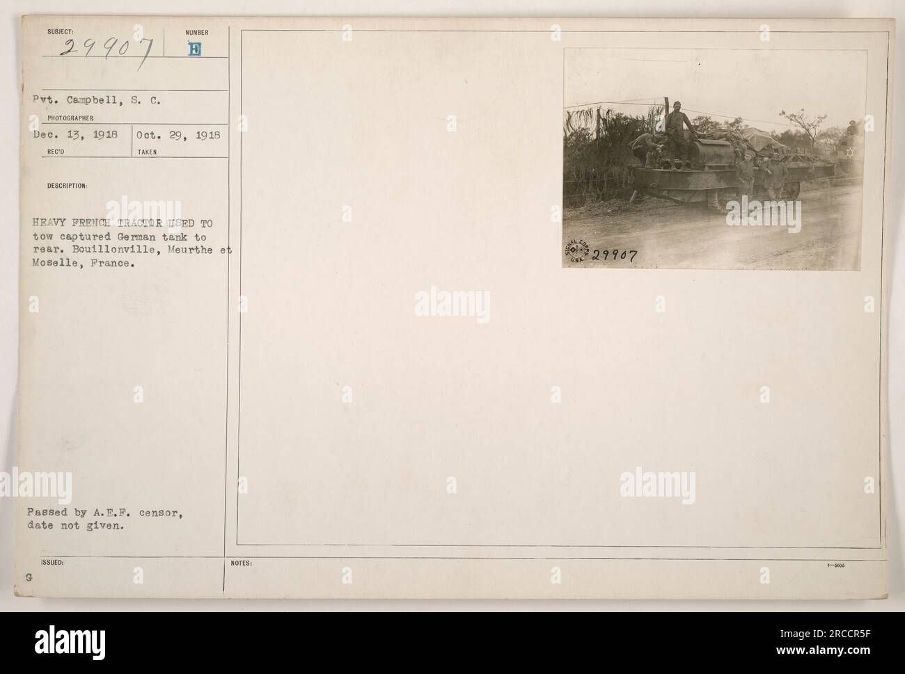 Pvt. Campbell operates a heavy French tractor to tow a captured German ...