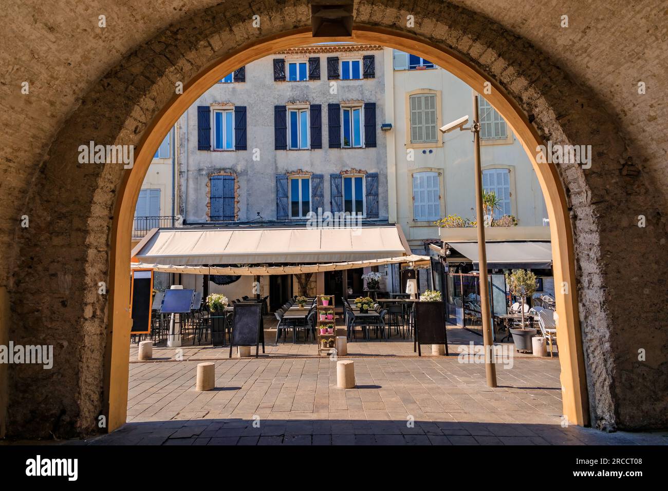 Arched passage way in the traditional medieval stone city walls of Old ...