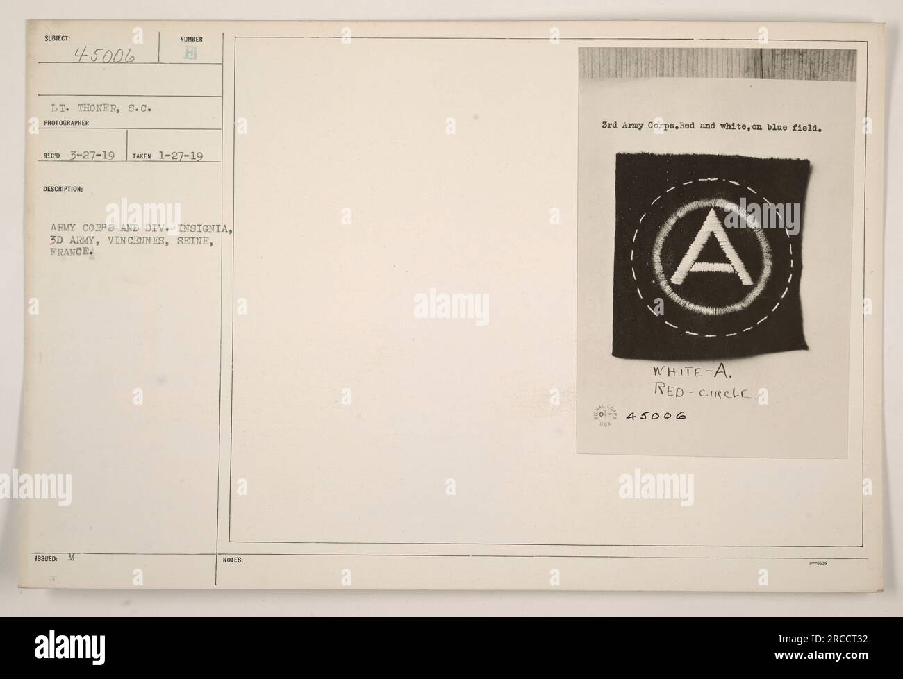 This photograph features the insignia of the 9th Army Corps and ...