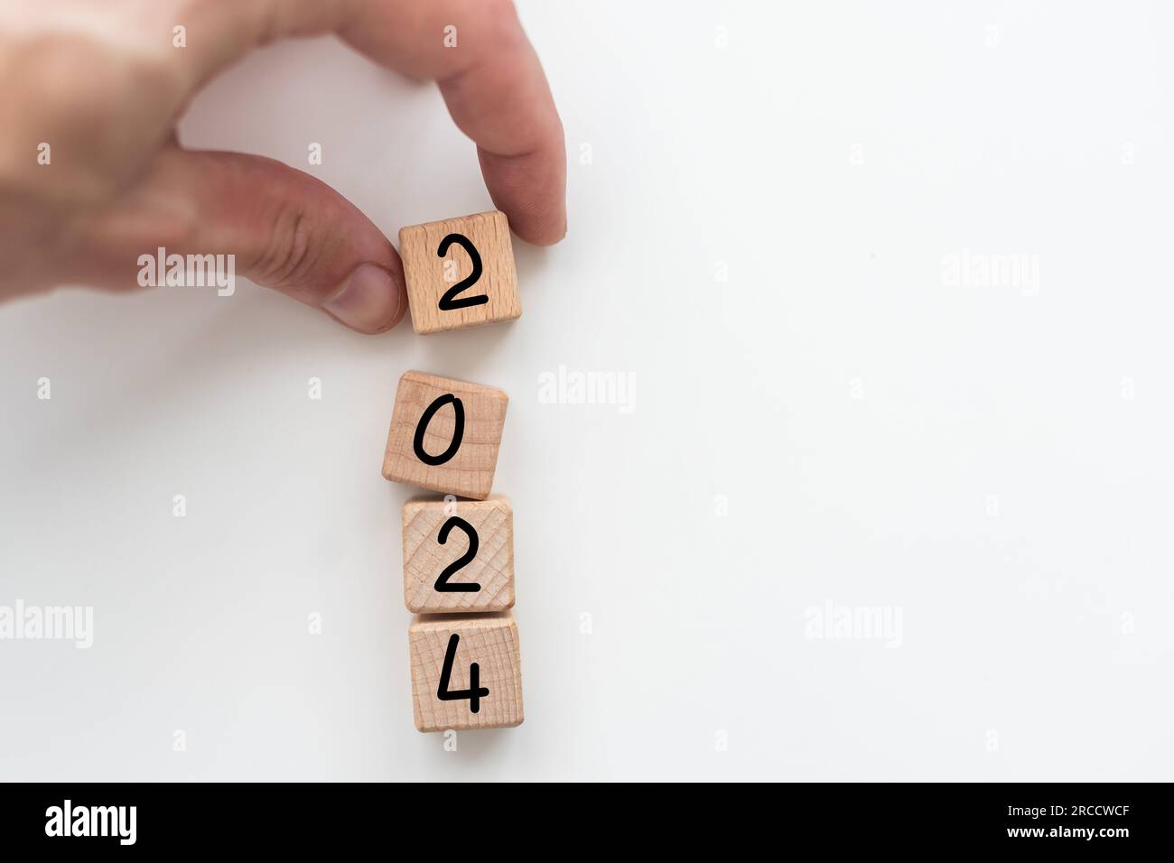 woodblocks cubes square with number 2024 on sand, business goals next ...