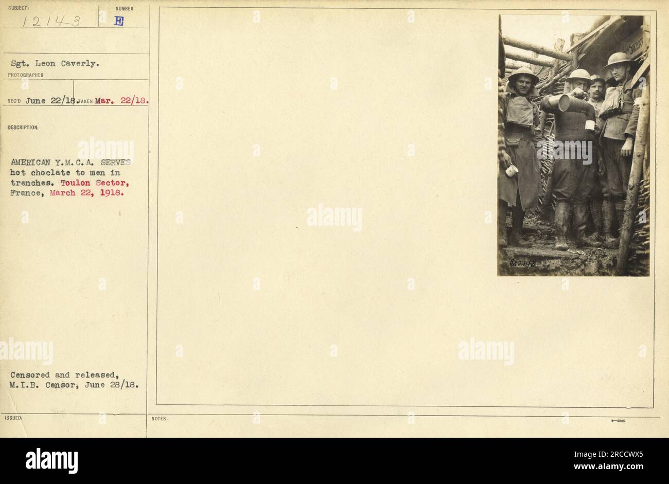Sergeant Leon Caverly of the American Y.M.C.A. serves hot chocolate to ...