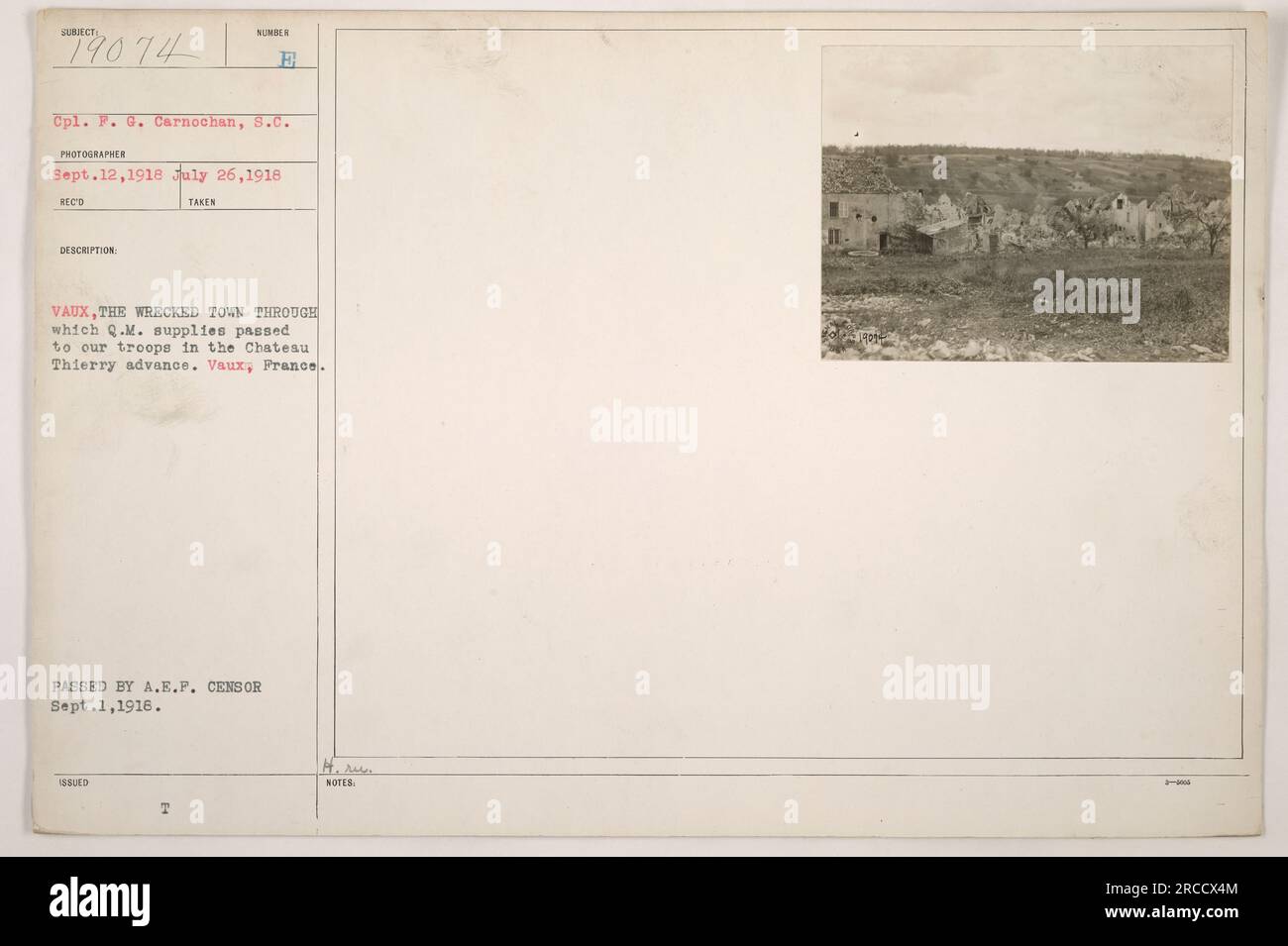 "Cpl. P. G. Carnochan, S.C. at Vaux, France, documenting the wreckage ...