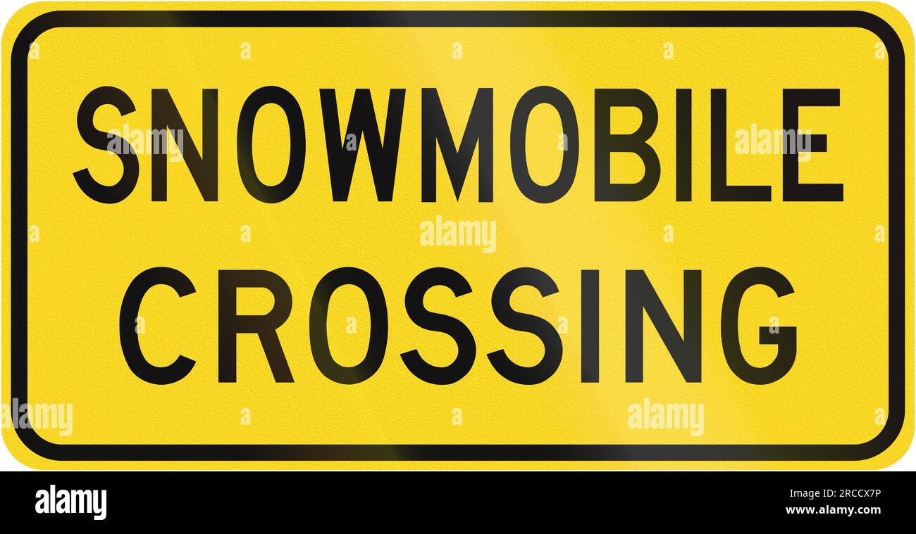 Warning road sign in Canada - Snowmobile crossing. This sign is used in ...