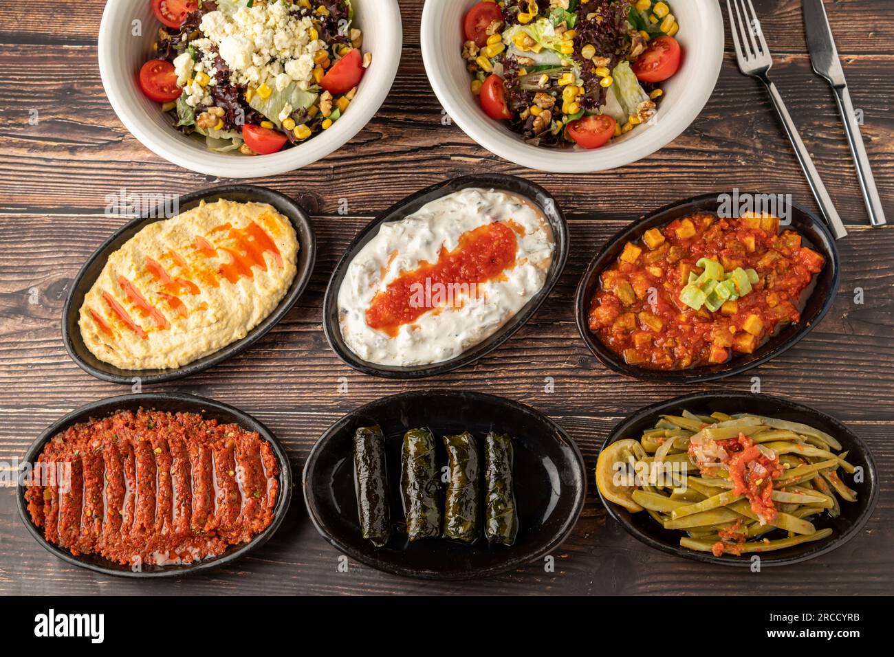 Different kinds of Turkish appetizers on white porcelain plates Stock ...