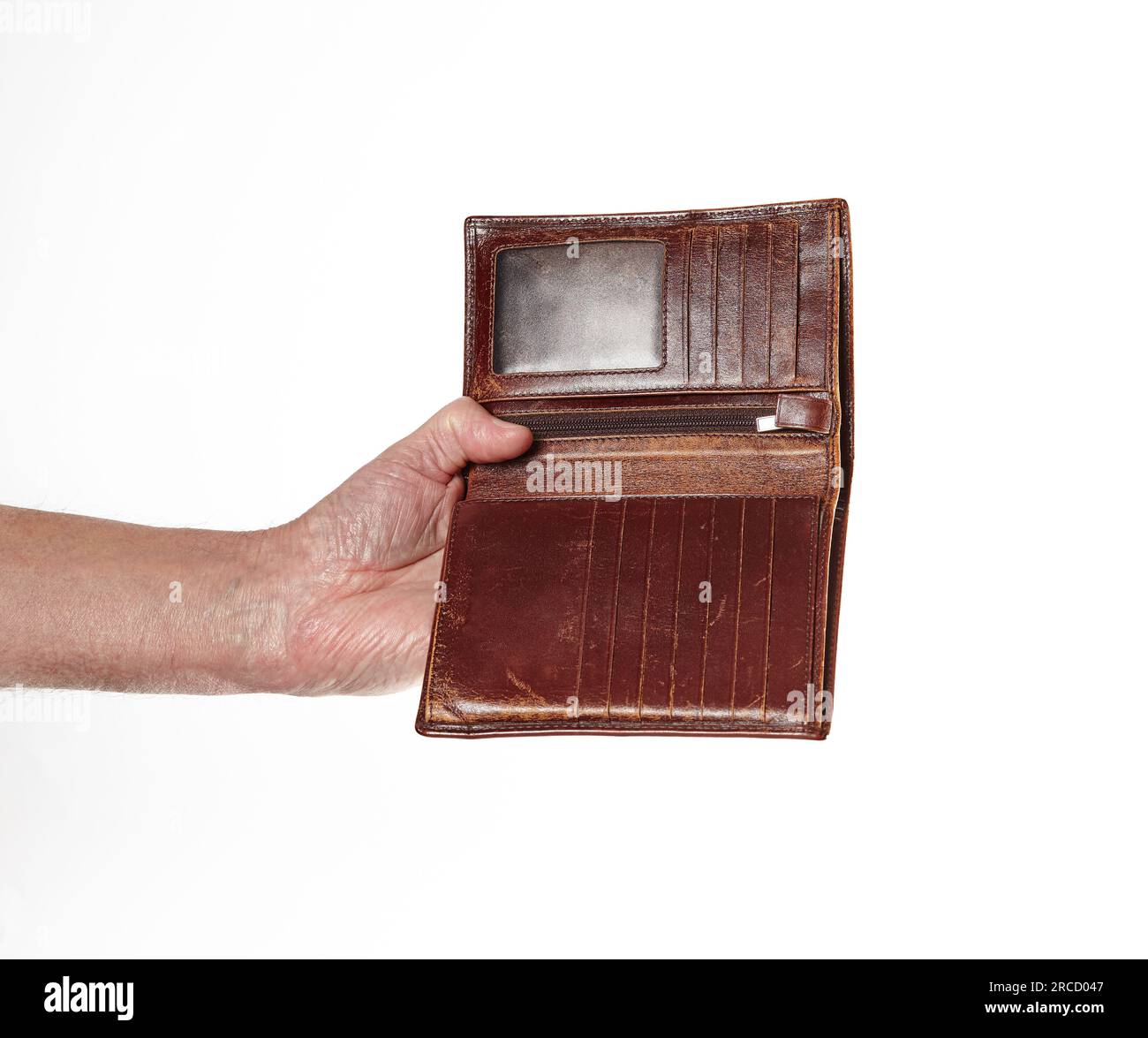 Men's hand holding leather wallet isolated on white background. Brown ...
