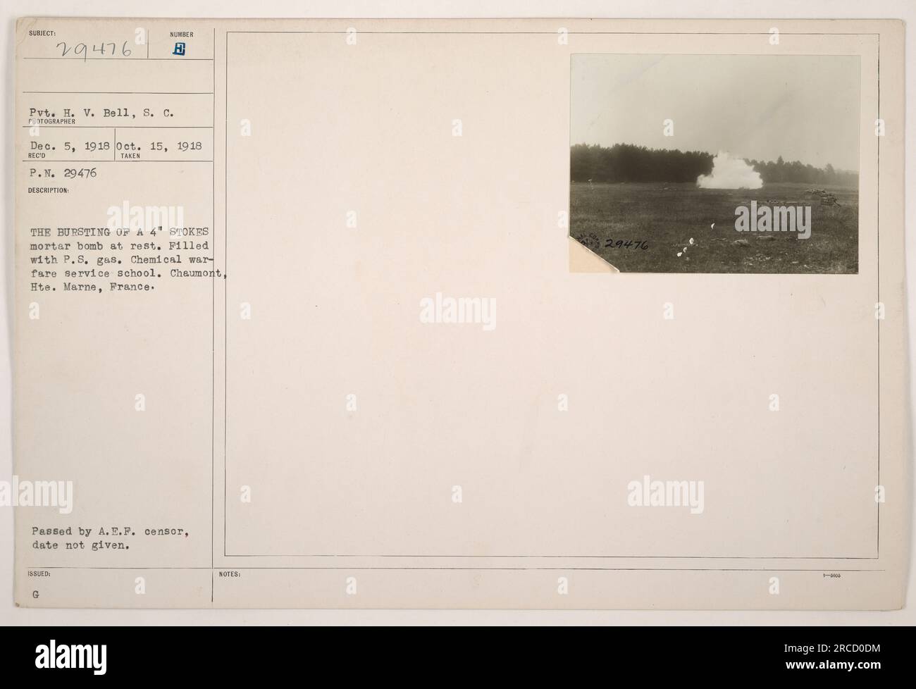 Pvt. H. V. Bell capturing the moment of a 4" Stokes mortar bomb ...