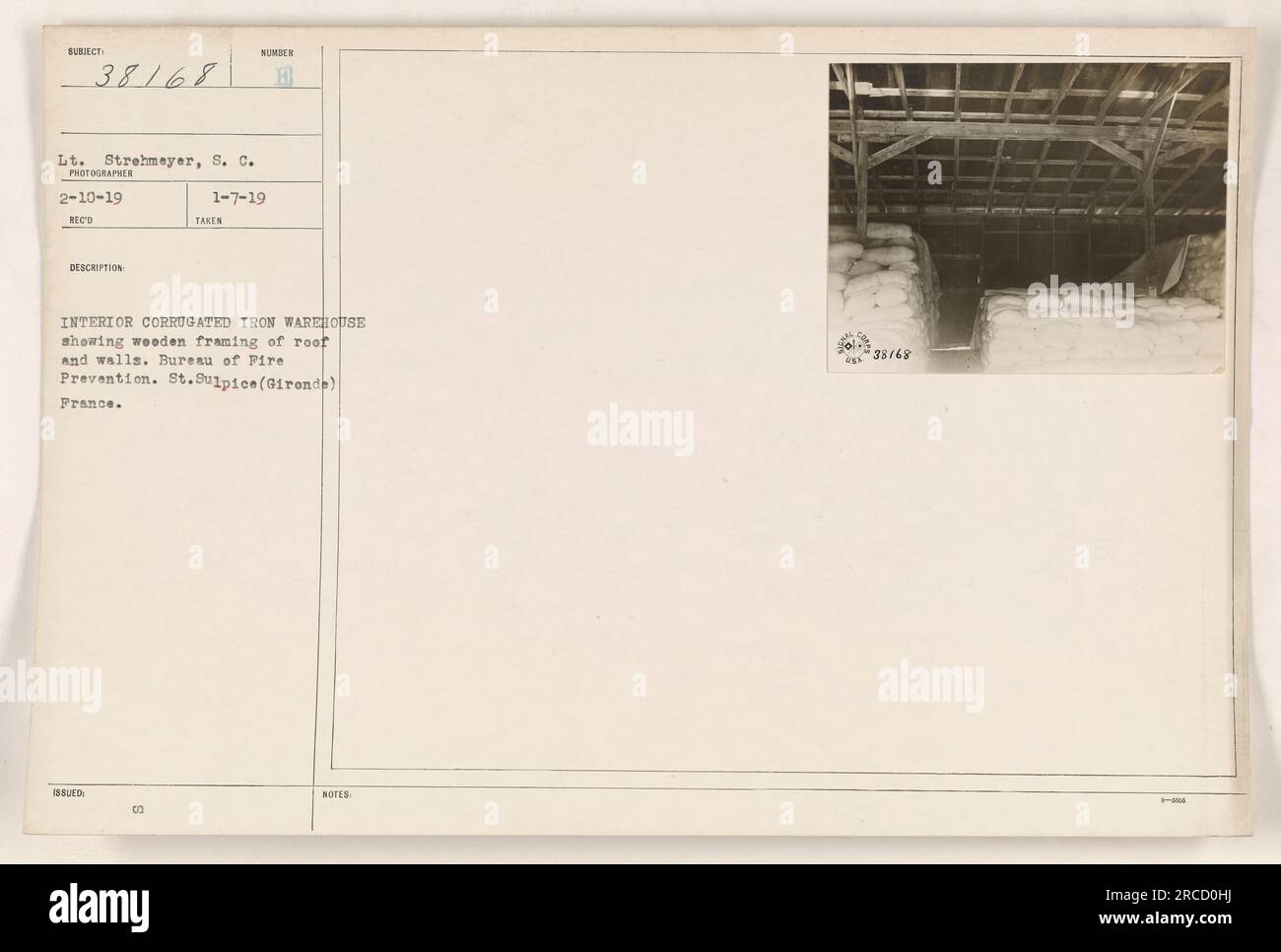 Interior view of a corrugated iron warehouse with wooden framing of ...