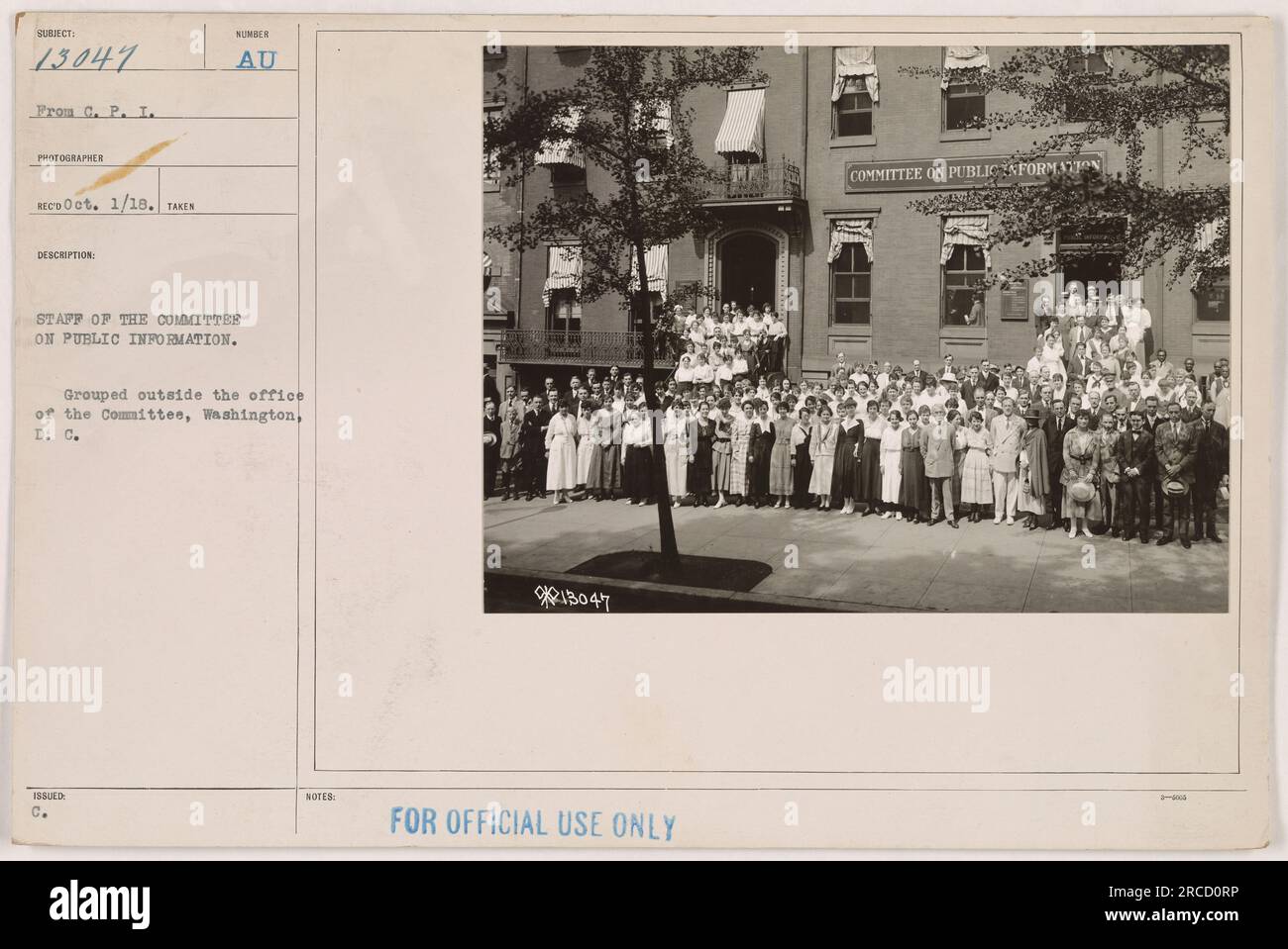 Group of American military personnel gathered outside the office of the ...