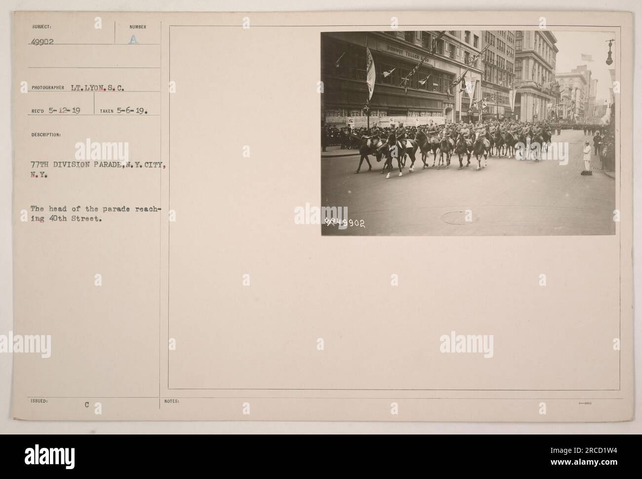 The image shows the 77th Division Parade in New York City, with the ...