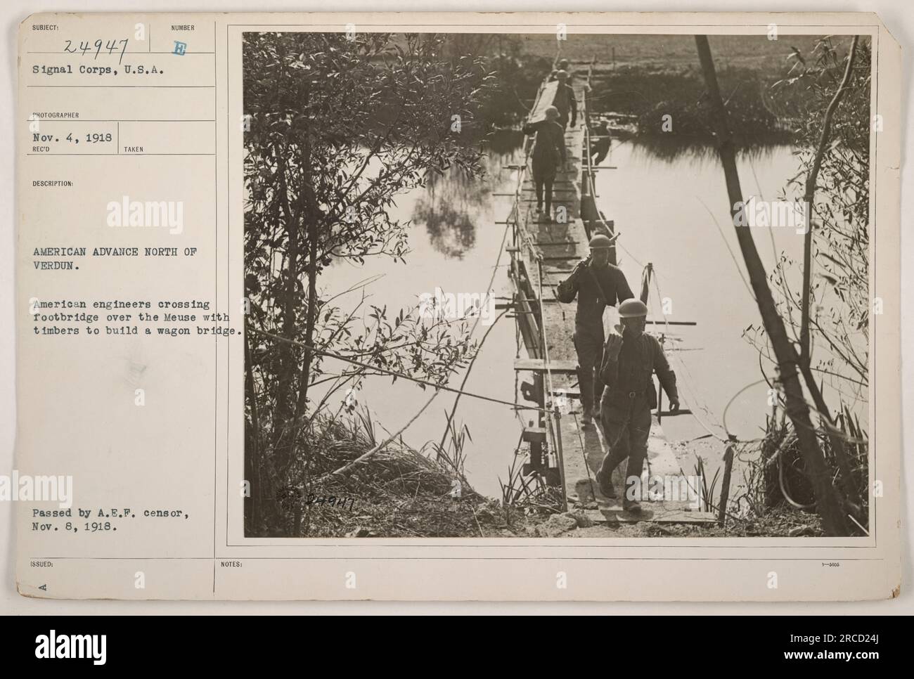 American engineers constructing a wagon bridge across the Meuse River ...