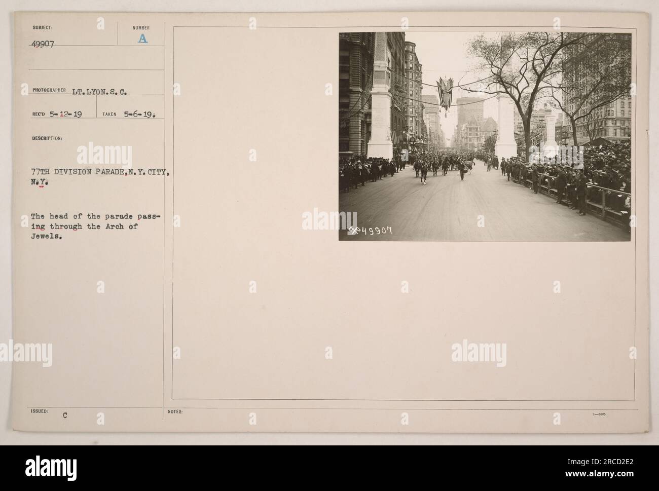 "Image shows the head of the 77th Division Parade passing through the ...