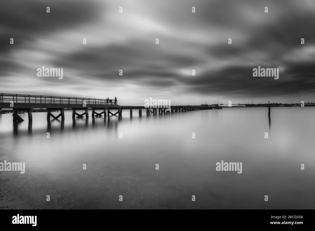 Enjoying peaceful times on the pier Stock Photo - Alamy