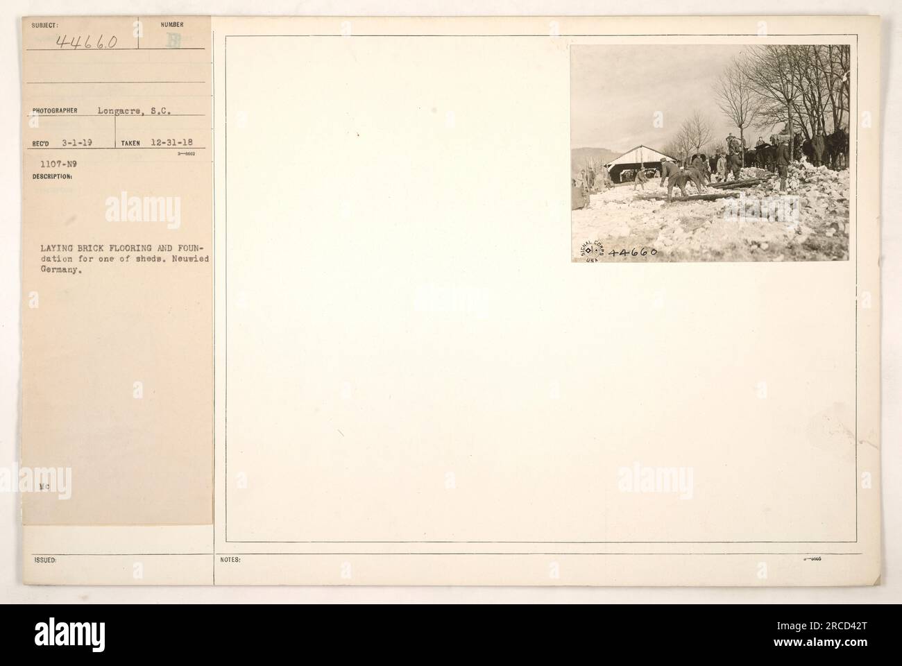 Soldiers laying brick flooring and foundation for a building in Neuwied ...