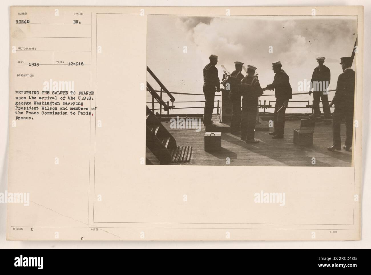 President Wilson and members of the Peace Commission salute as they ...