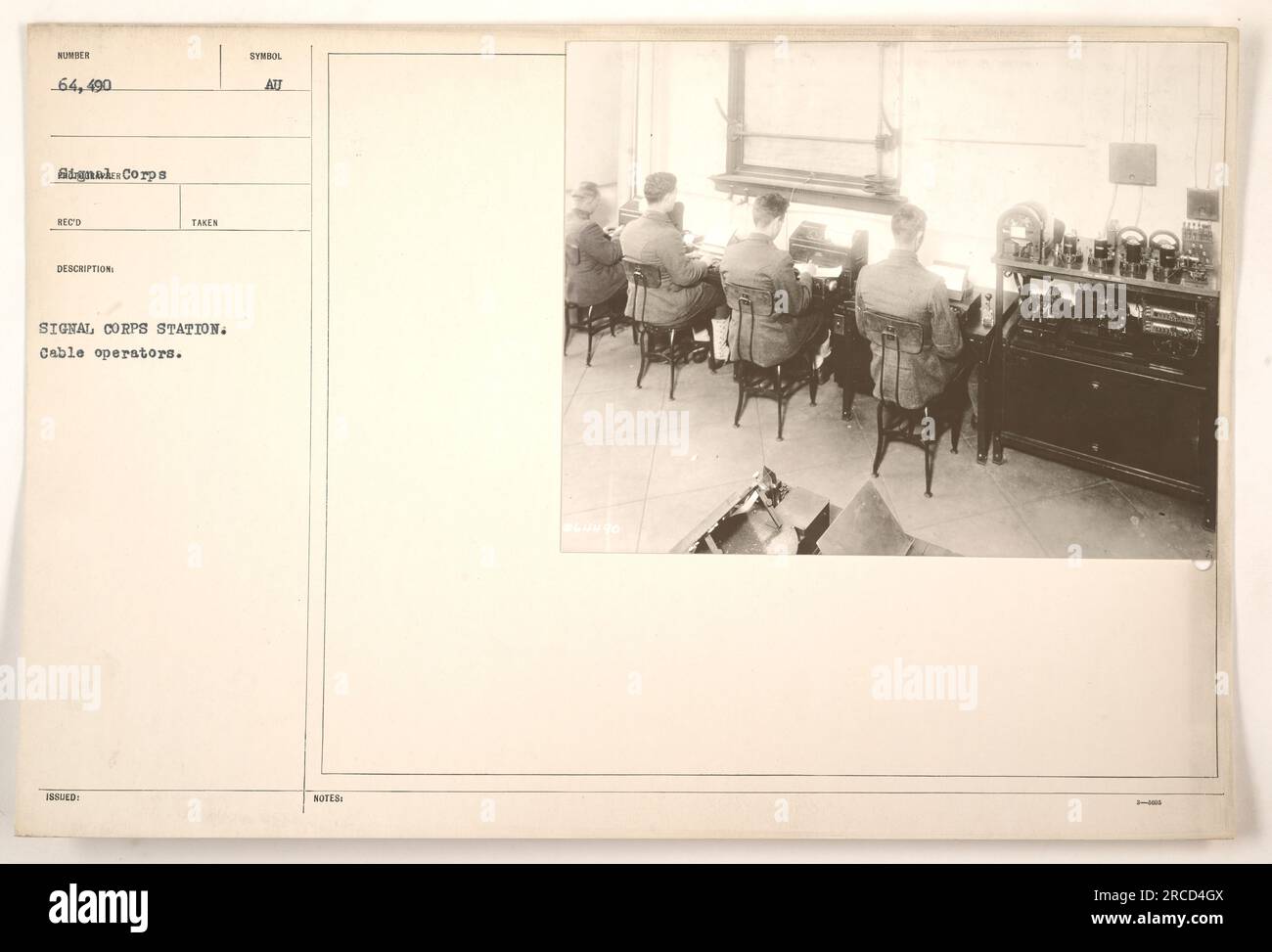 Cable operators at Signal Corps station working on communication during ...