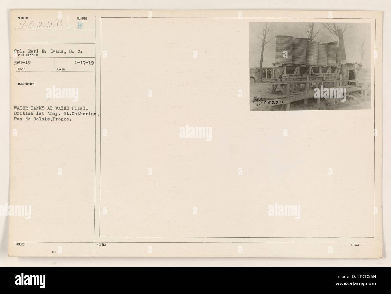 Water tanks being filled at a water point in St. Catherine, Pas de ...