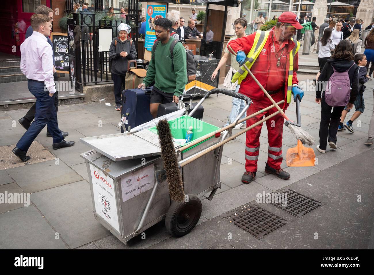A street cleaning contractor with Veolia keeps the pavement litter-free ...